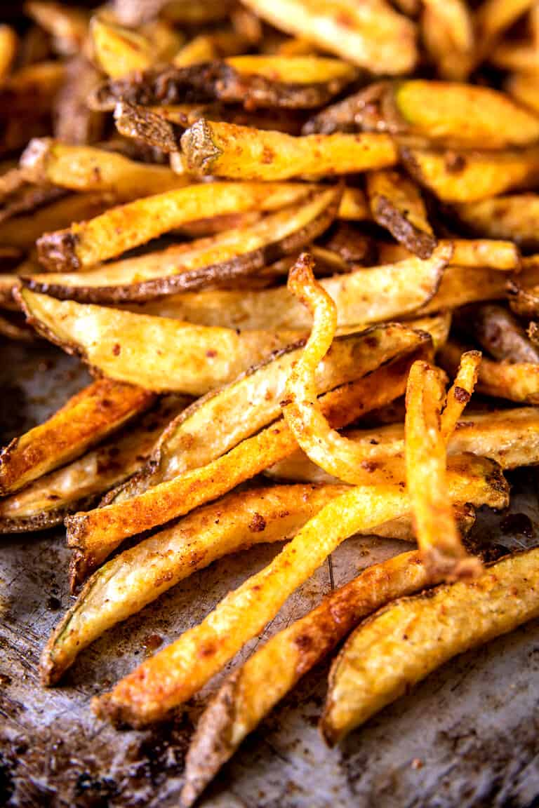 Garlic Parmesan French Fries Dressed in Caesar Dressing. - Half Baked ...