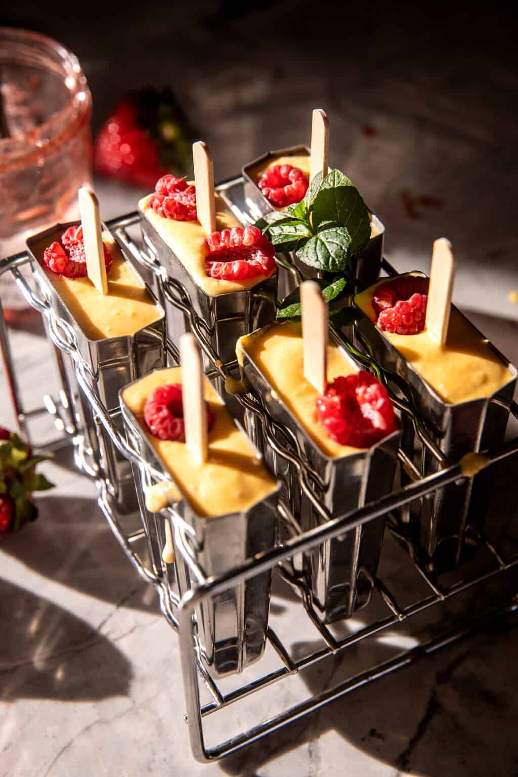 Creamy Strawberry Mango Popsicles. - Half Baked Harvest